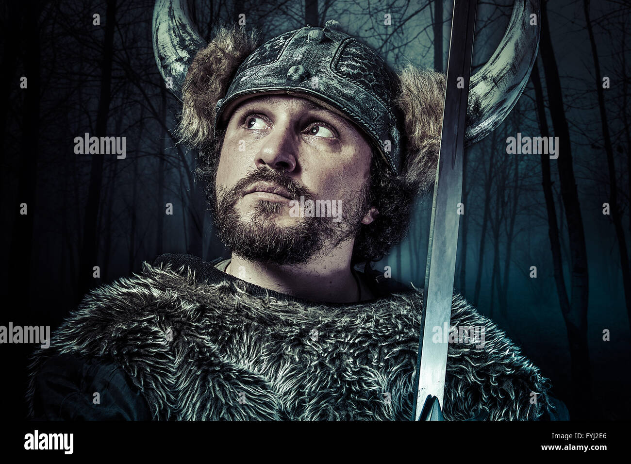 Viking warrior, male dressed in Barbarian style with sword, bearded ...