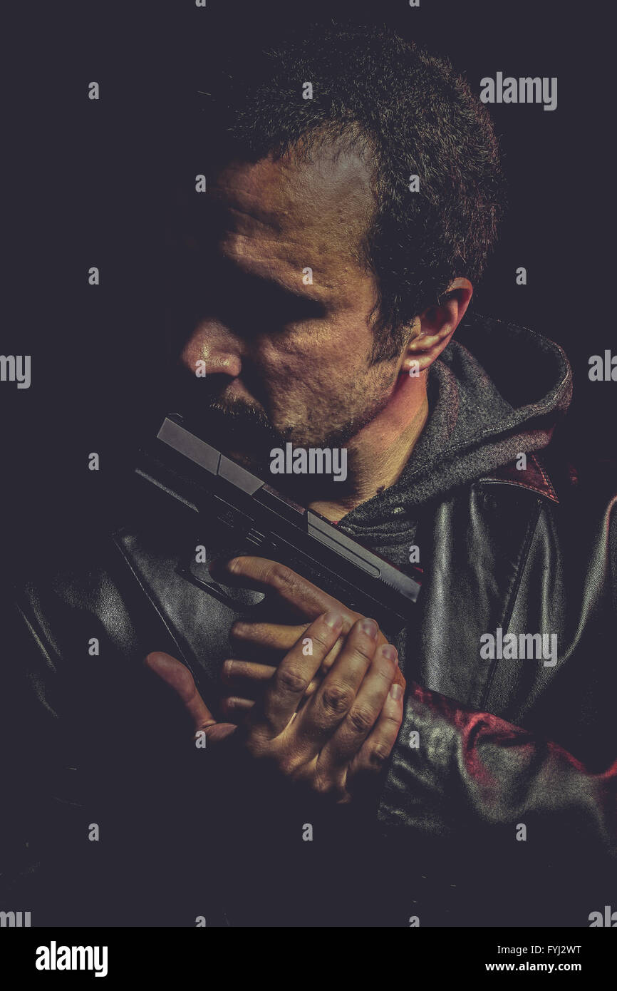 Robber with gun. Man in suit draws vintage handgun Stock Photo - Alamy