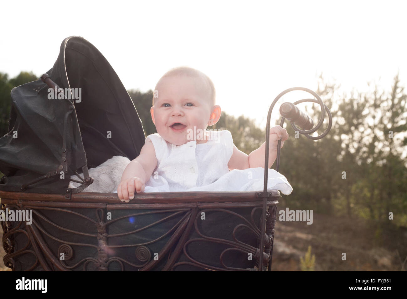 Happy baby in her pram Stock Photo - Alamy