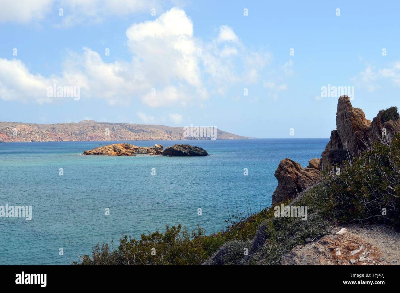 A creek in Crete with rocks, island and of the greenery Stock Photo - Alamy