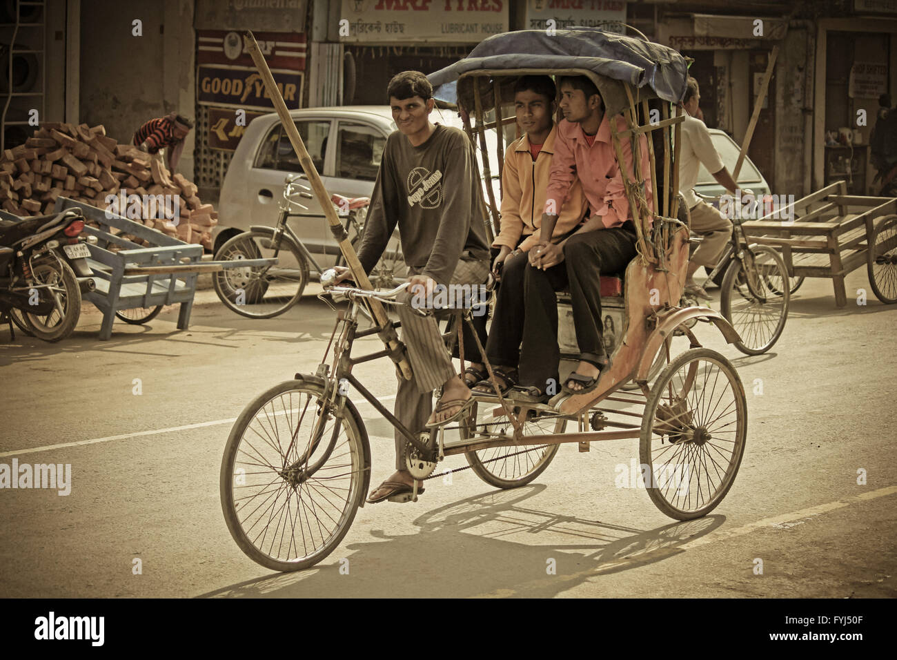 Market street cycle rickshaw hi-res stock photography and images - Alamy