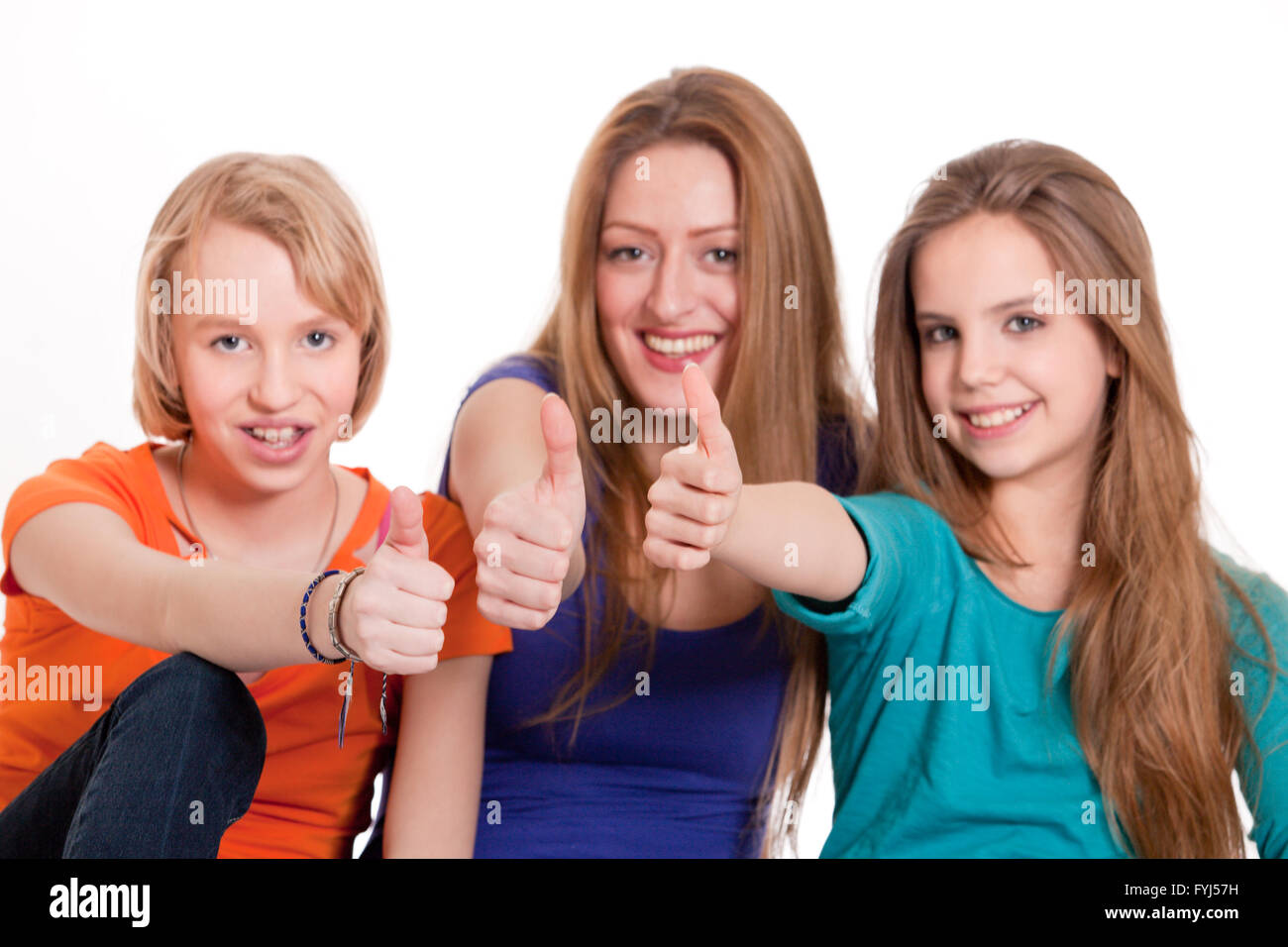 3 woman thumbs up Stock Photo - Alamy