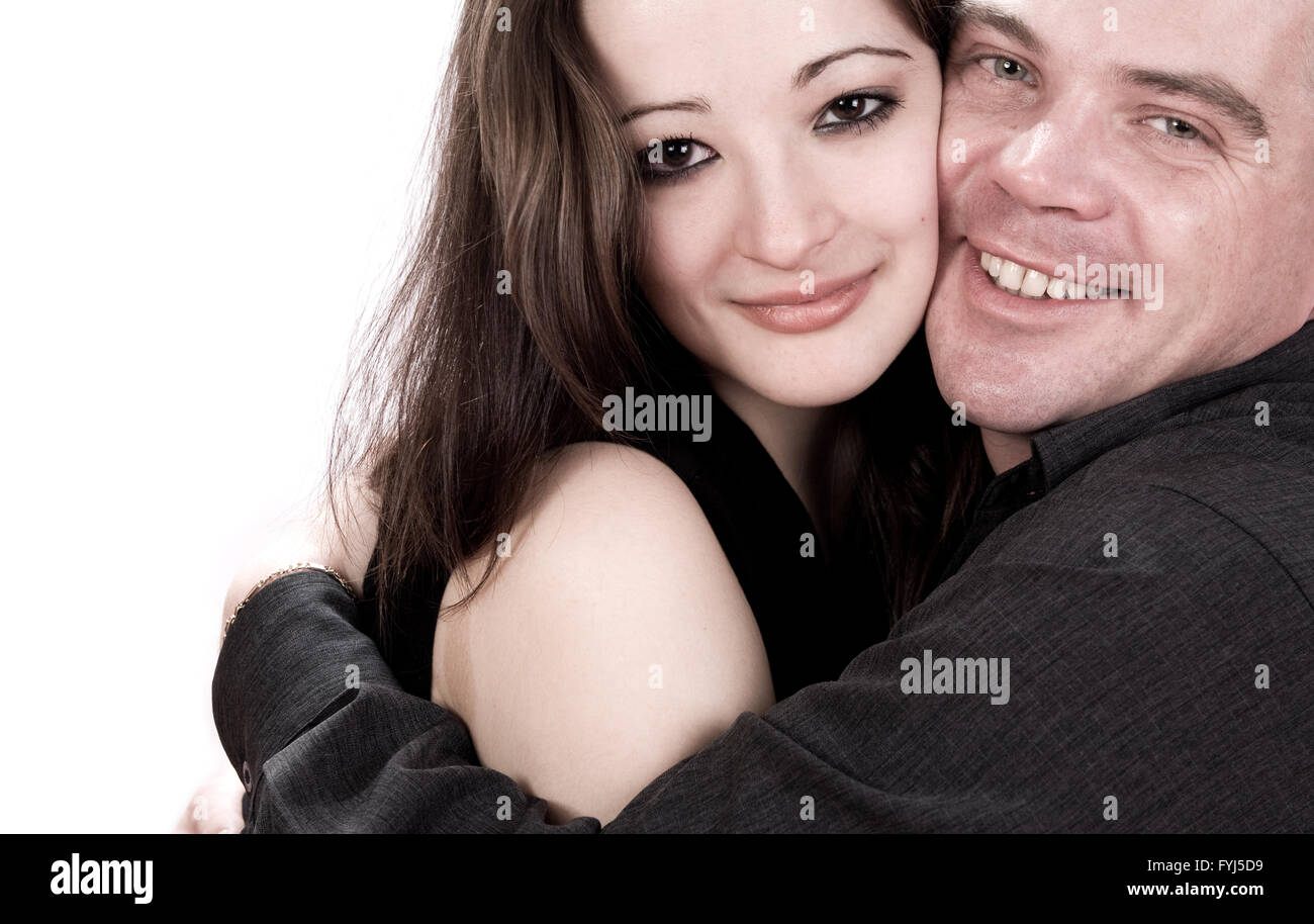 Young couple hugging Stock Photo - Alamy