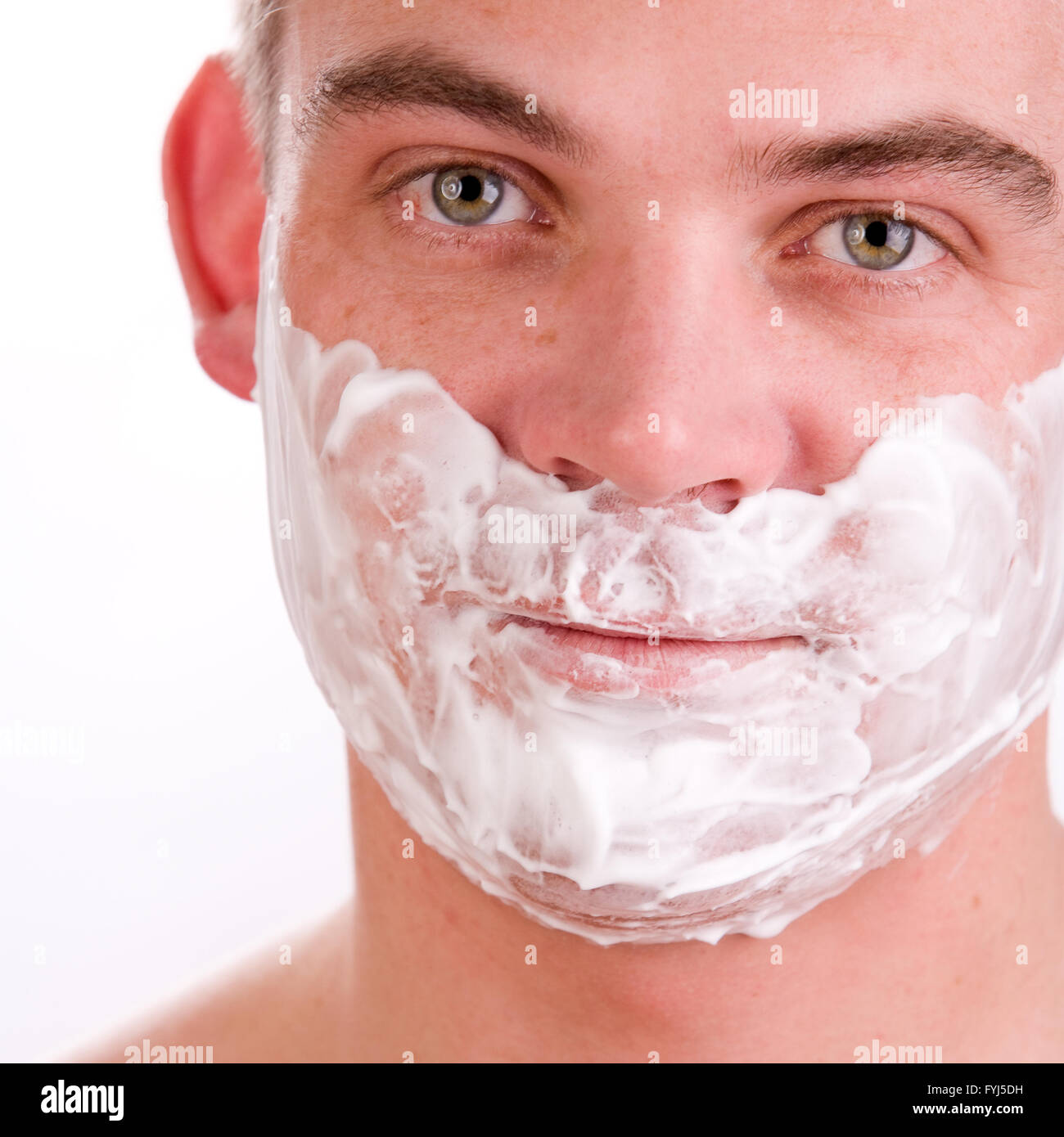 Shaving young man Stock Photo - Alamy