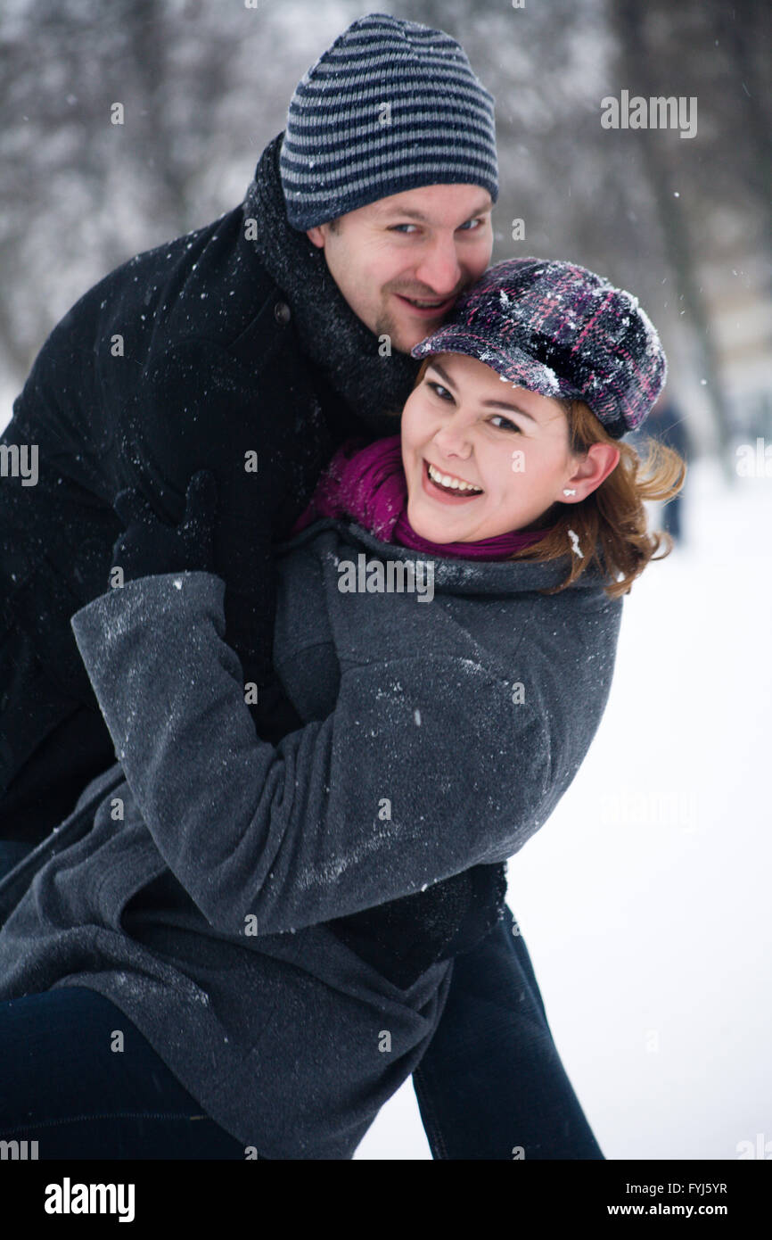 Happy loving couple enjoying winter hi-res stock photography and images ...