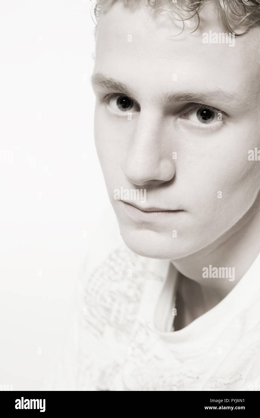 Young man looking aside Stock Photo - Alamy