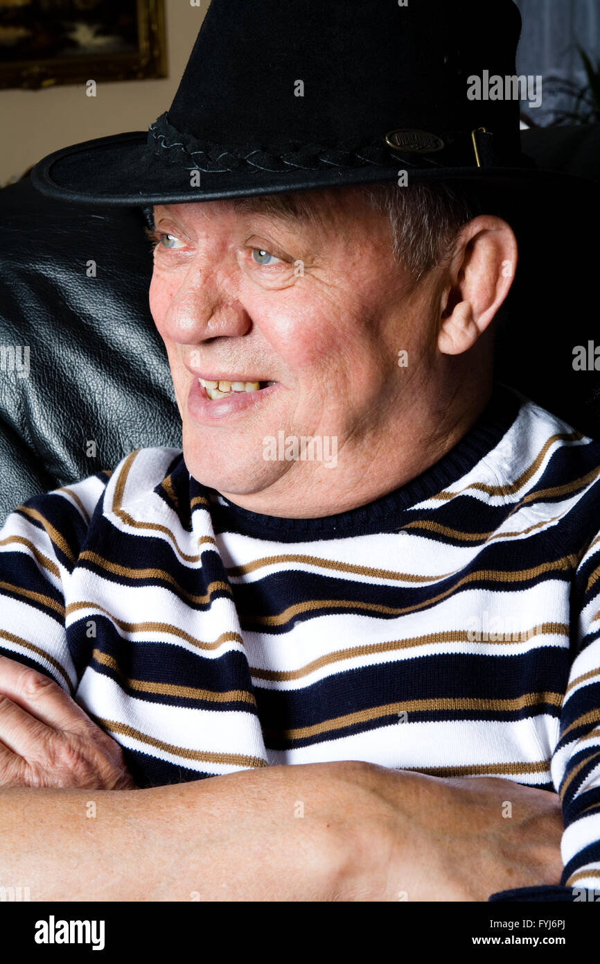 Grandfather with a black cowboy hat posing Stock Photo - Alamy