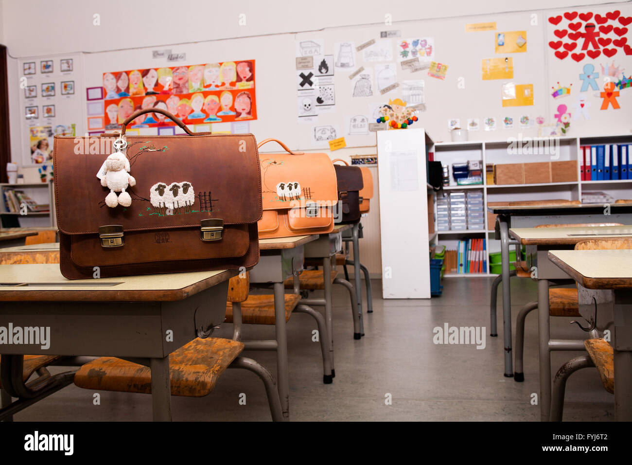 School bags on classroom table hi-res stock photography and images - Alamy