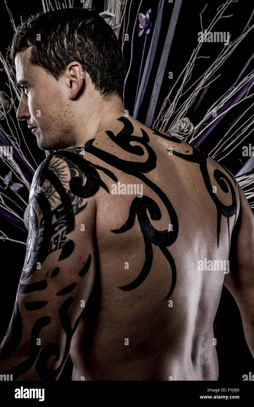 One. Young attractive retro model in old-fashioned wild clothing Tribe ...