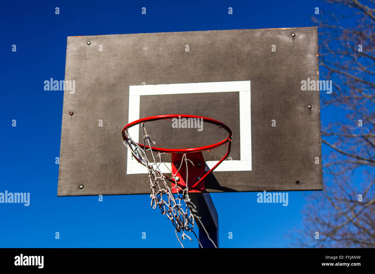 Basketball backboard on blue sky background Stock Photo - Alamy