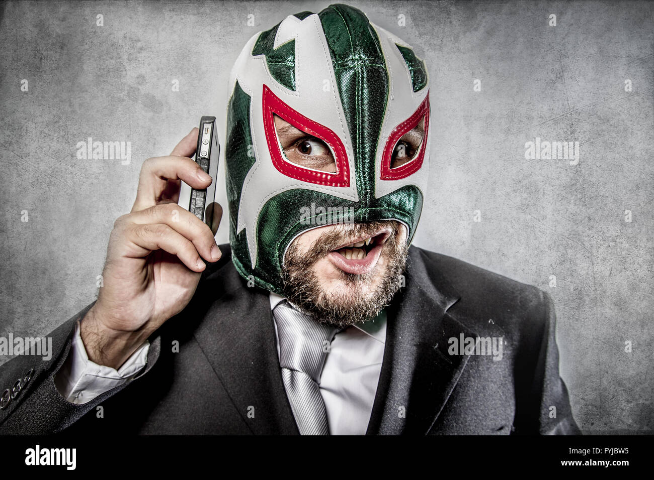Trouble, aggressive executive suit and tie, Mexican wrestler mask Stock ...