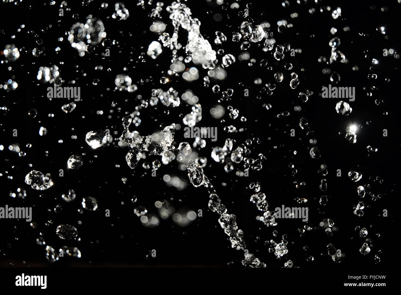 Water levitation. Bright drops flying in the air Stock Photo - Alamy