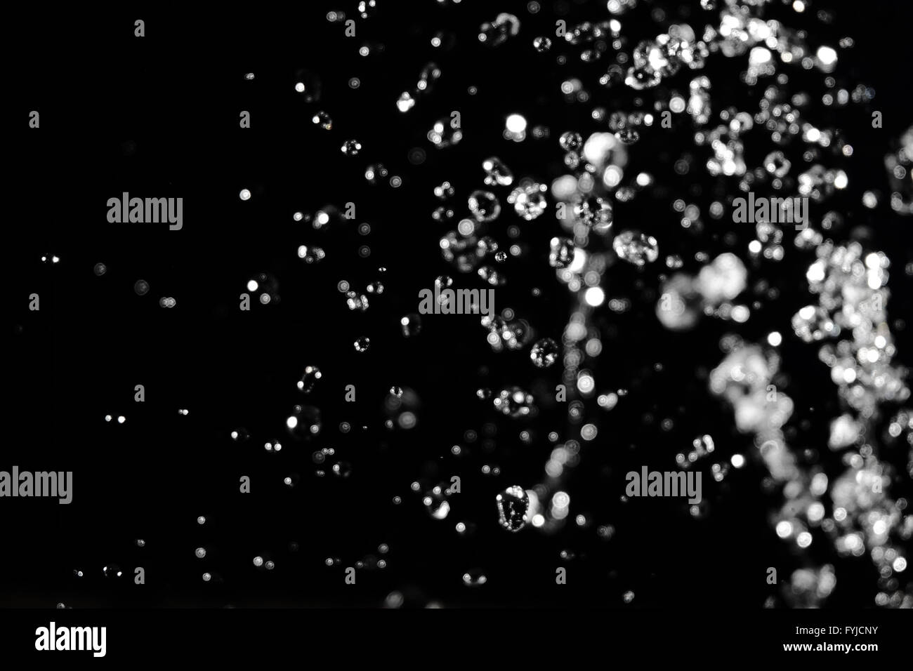 Water levitation with defocused lights on background Stock Photo - Alamy