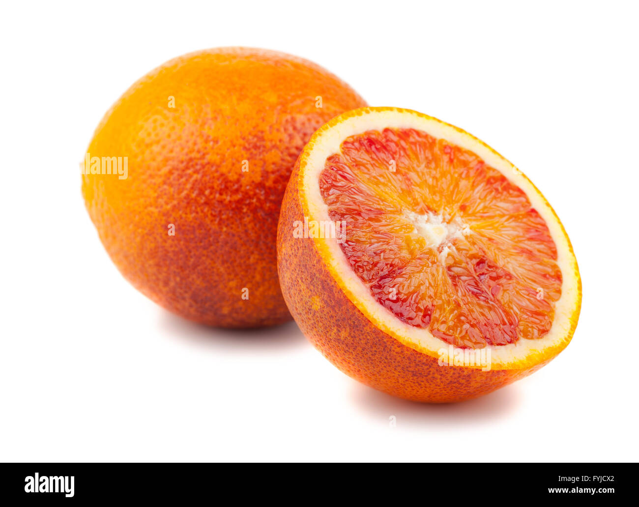 Half and full bloody red oranges Stock Photo - Alamy