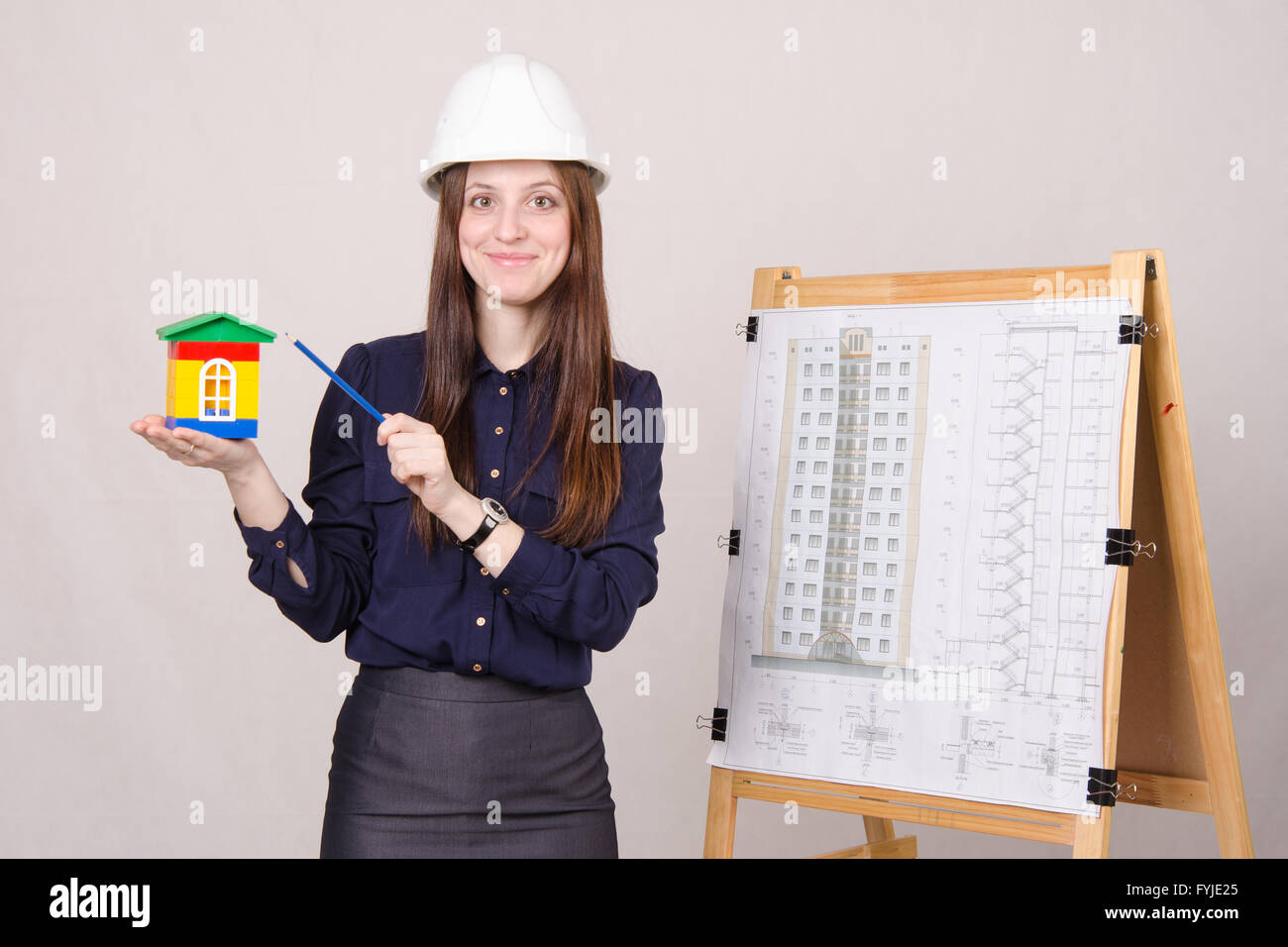 Girl gives a presentation of the new multi-storey building Stock Photo ...
