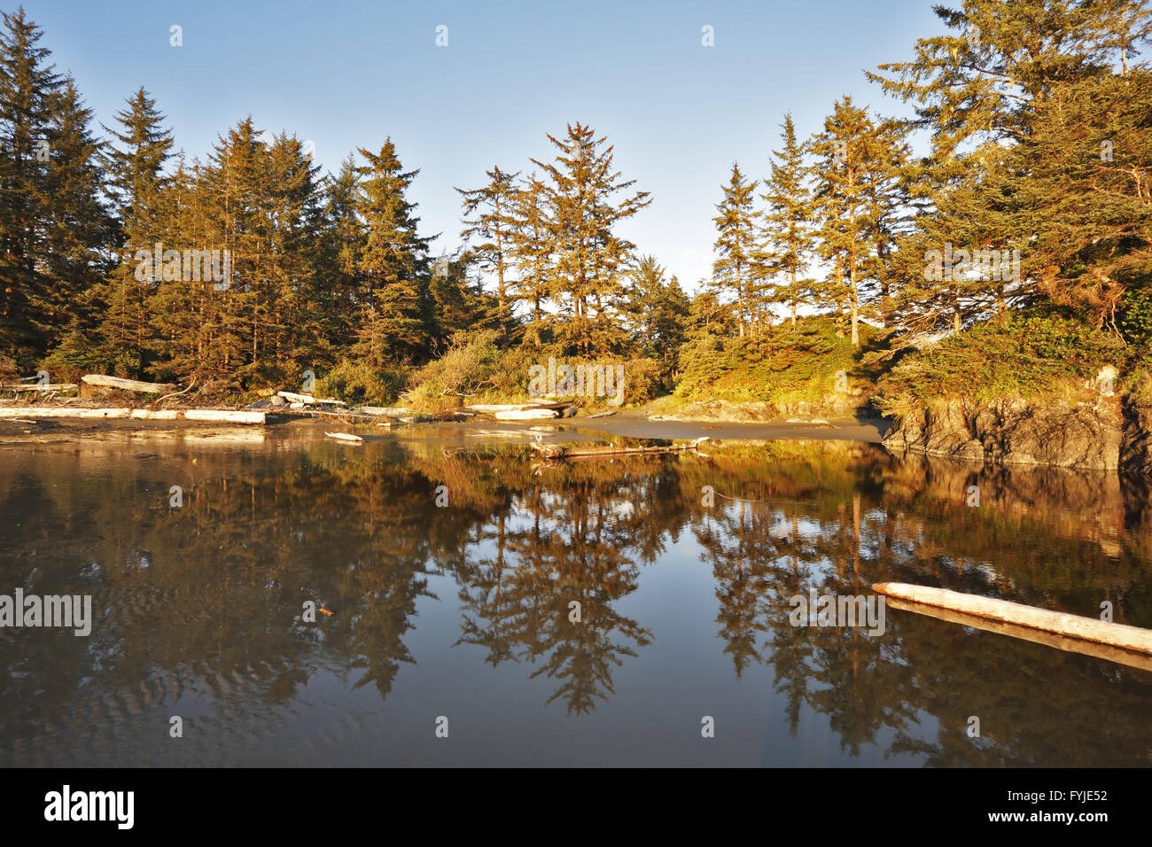 Picturesque beach and small islands on a sunset Stock Photo - Alamy