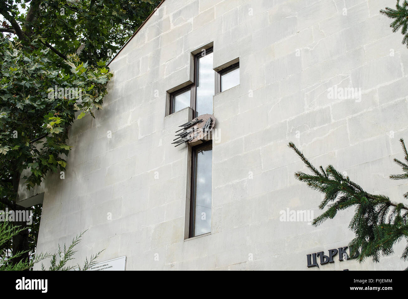 Cross of church on wall Stock Photo - Alamy