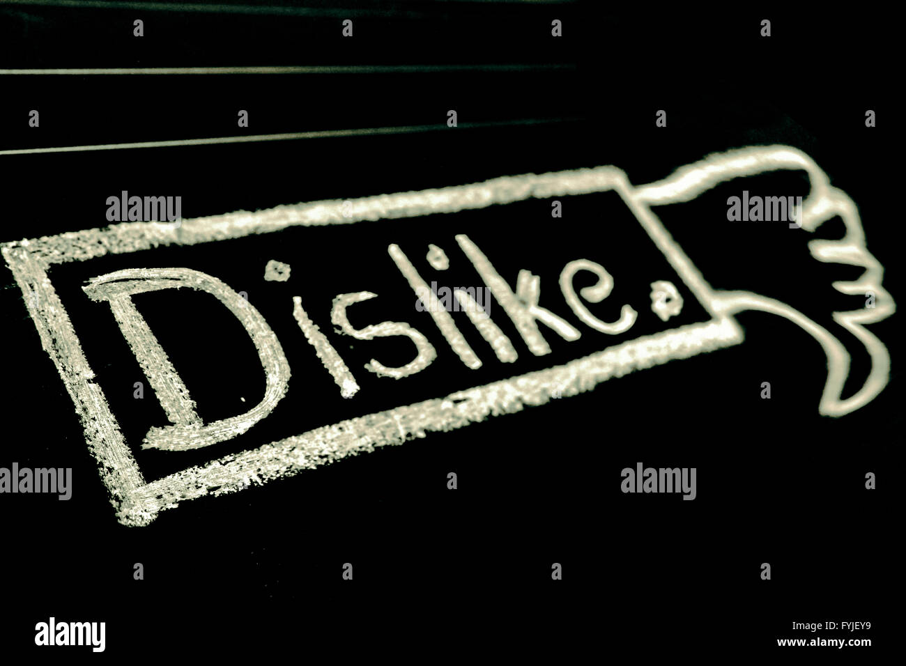 Dislike Icon handwritten on black chalkboard Stock Photo - Alamy