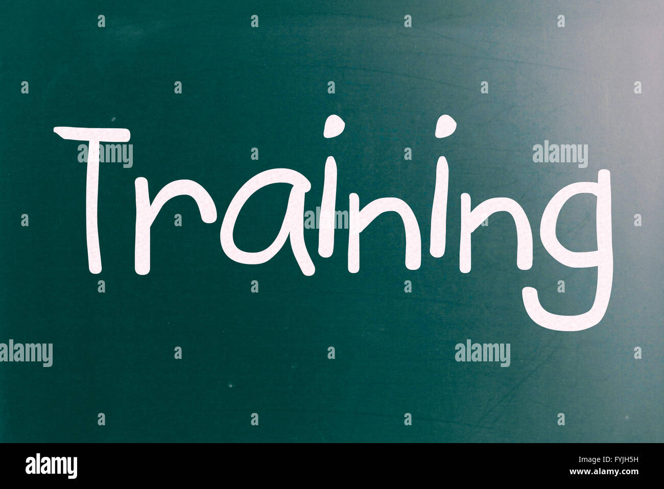 The word Training handwritten with white chalk on a blackboard Stock ...