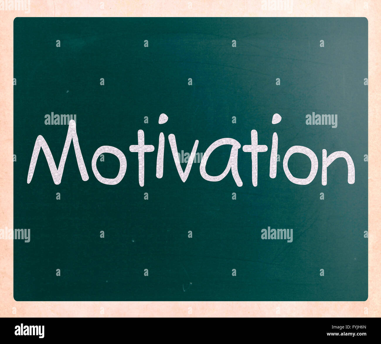 Motivation handwritten with white chalk on a blackboard Stock Photo - Alamy