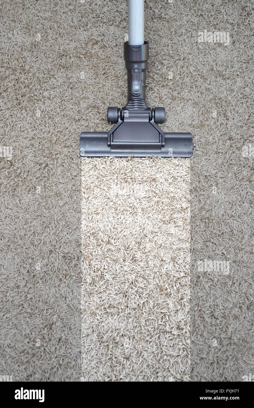 A vacuum cleaner isolated against a white background Stock Photo - Alamy