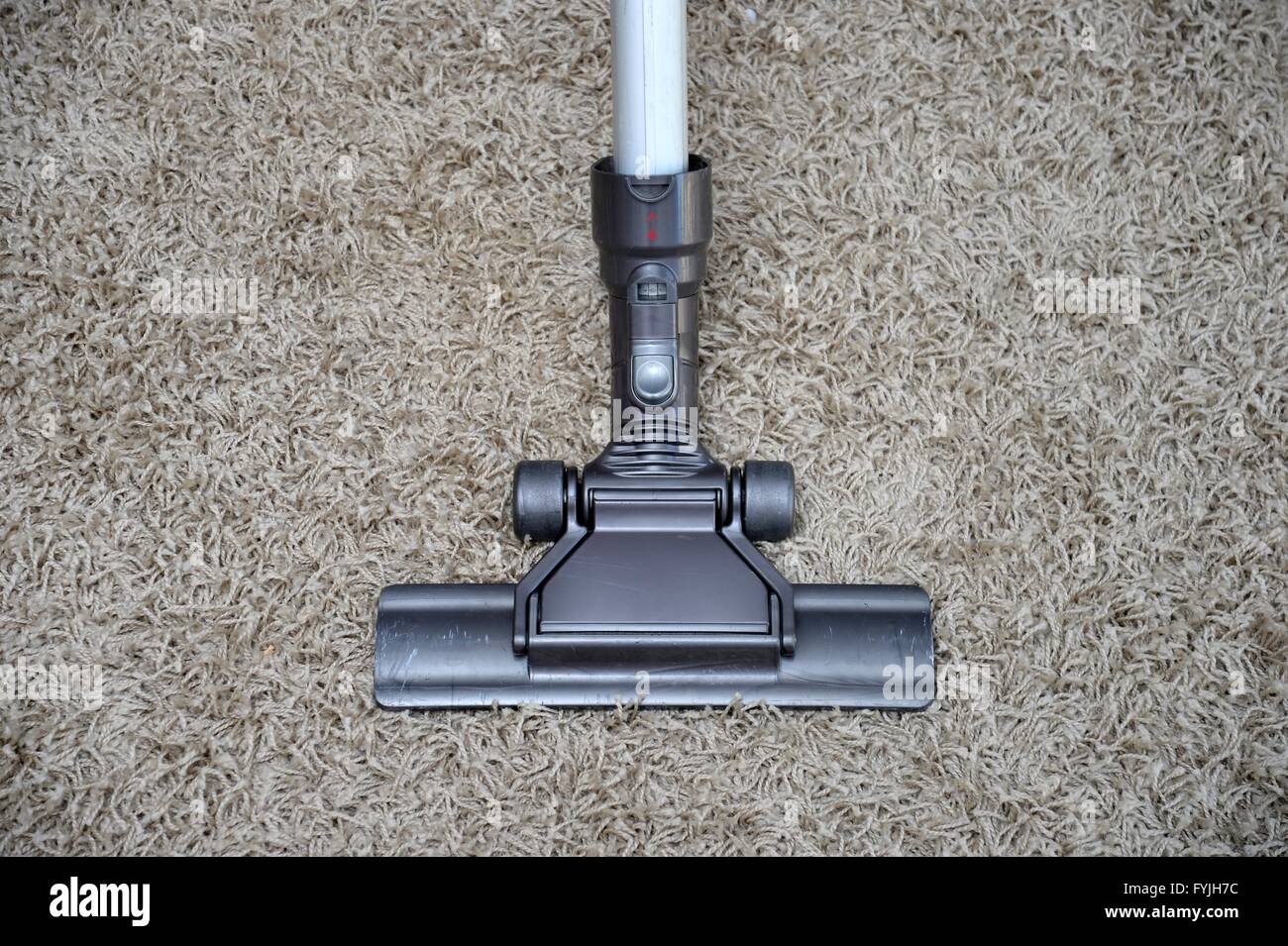 A vacuum cleaner isolated against a white background Stock Photo - Alamy