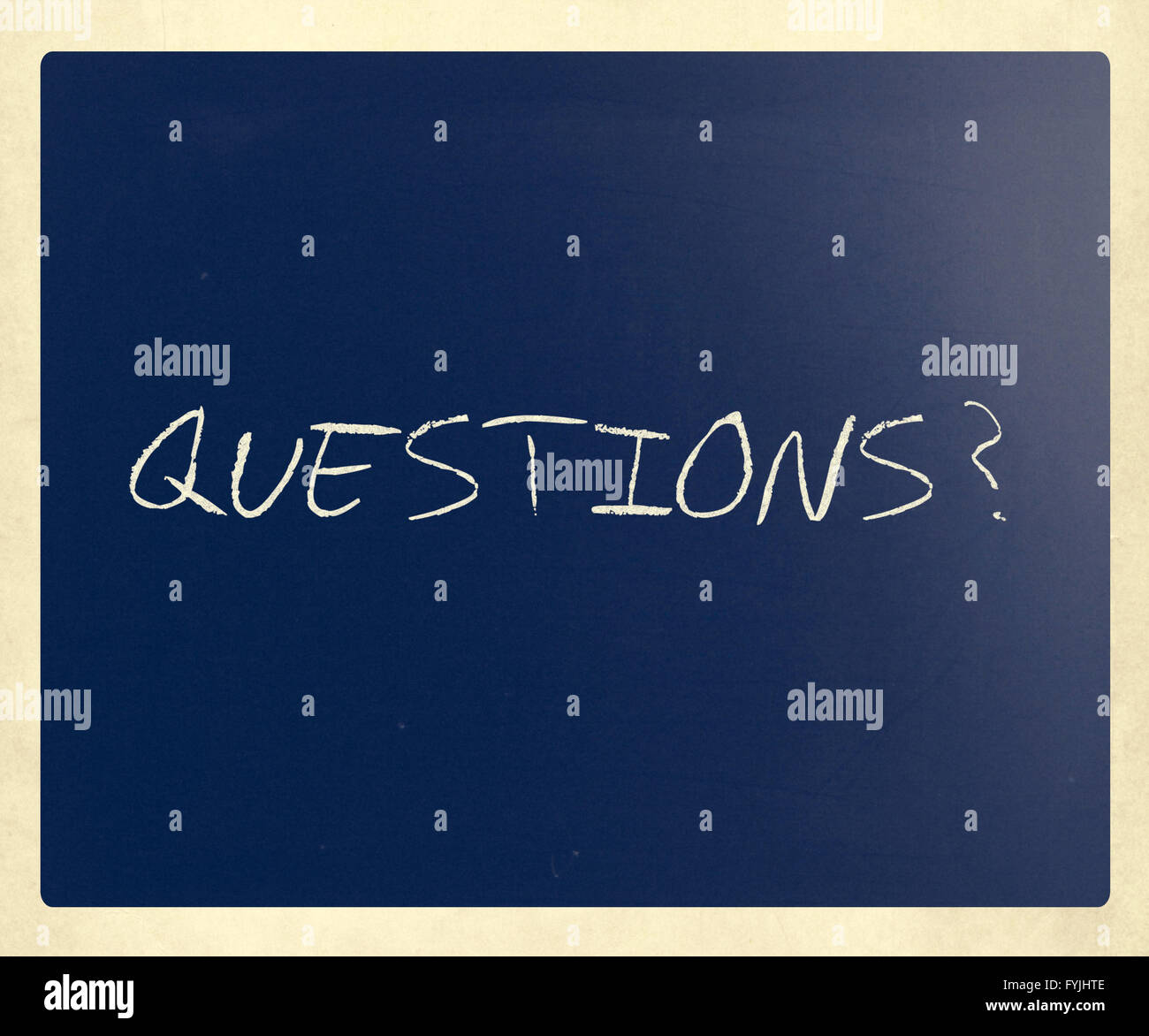 Questions? handwritten with white chalk on a blackboard Stock Photo - Alamy