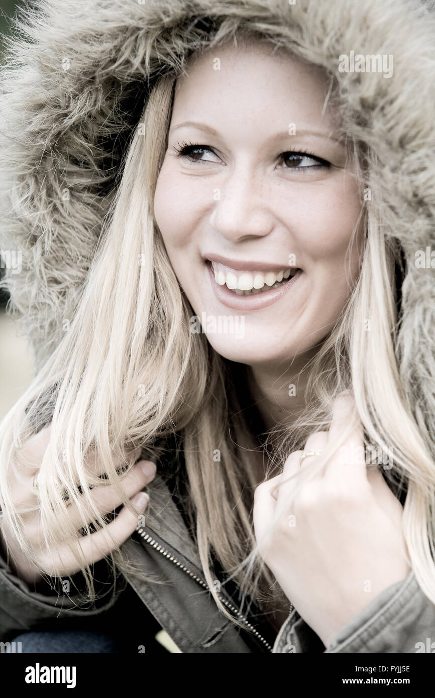 Smiling with my jacket Stock Photo - Alamy