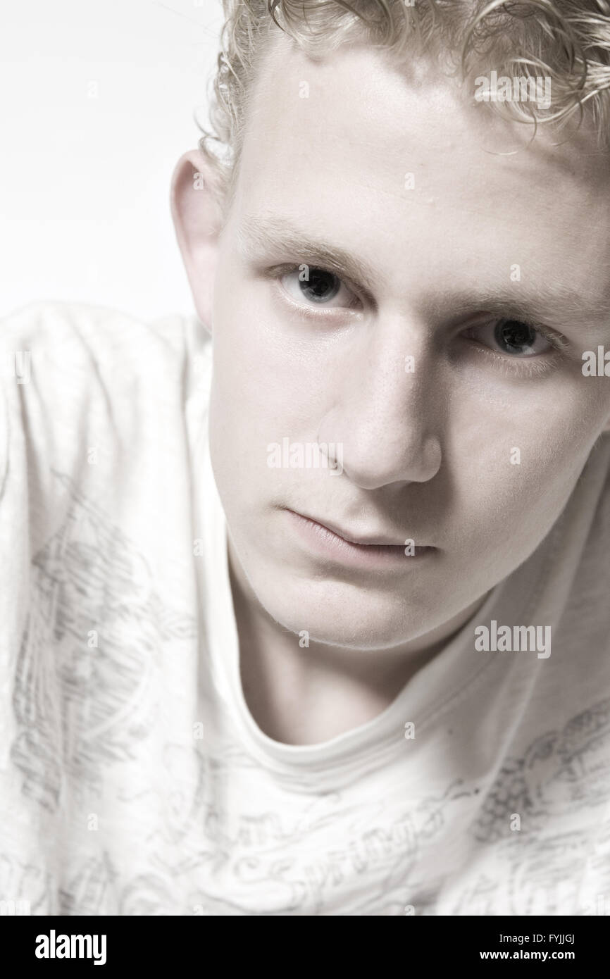 Young man making eye contact Stock Photo - Alamy