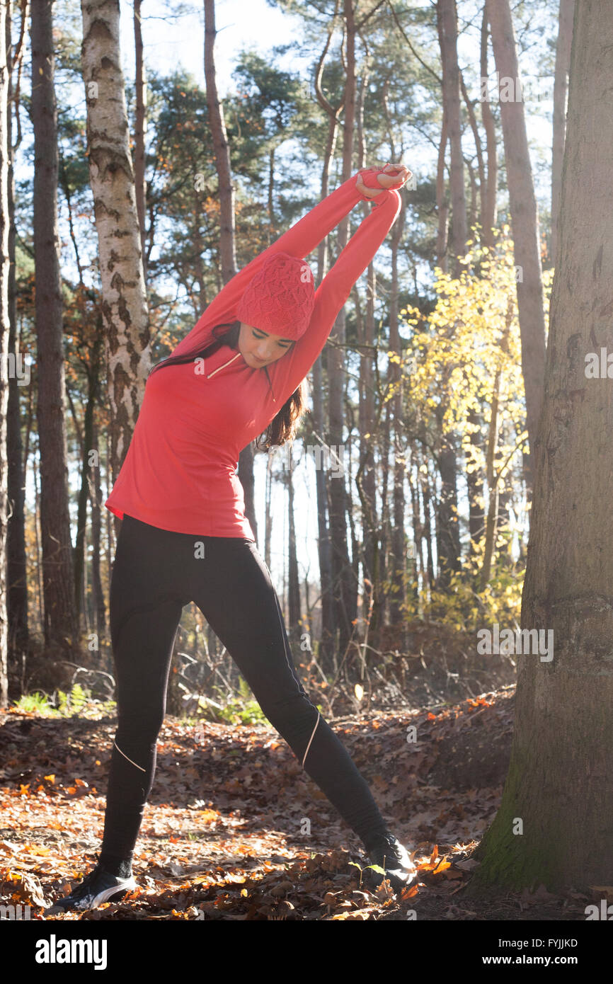 Stretching in the forest Stock Photo - Alamy