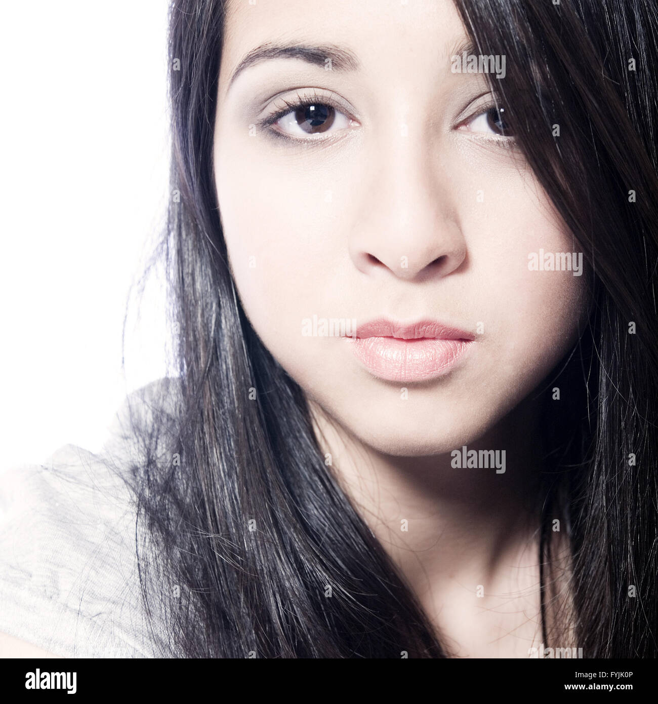 Asian teenager making eye contact Stock Photo - Alamy