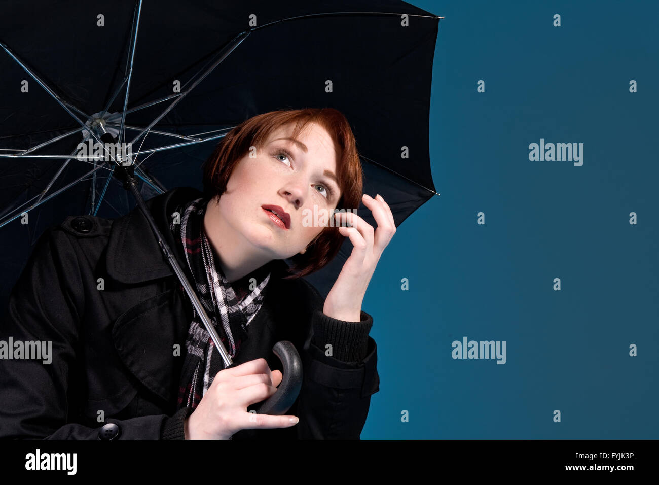 Waiting for the rain to stop Stock Photo - Alamy
