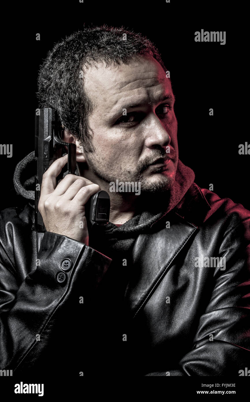 thief, armed man with black leather jacket, dangerous Stock Photo - Alamy