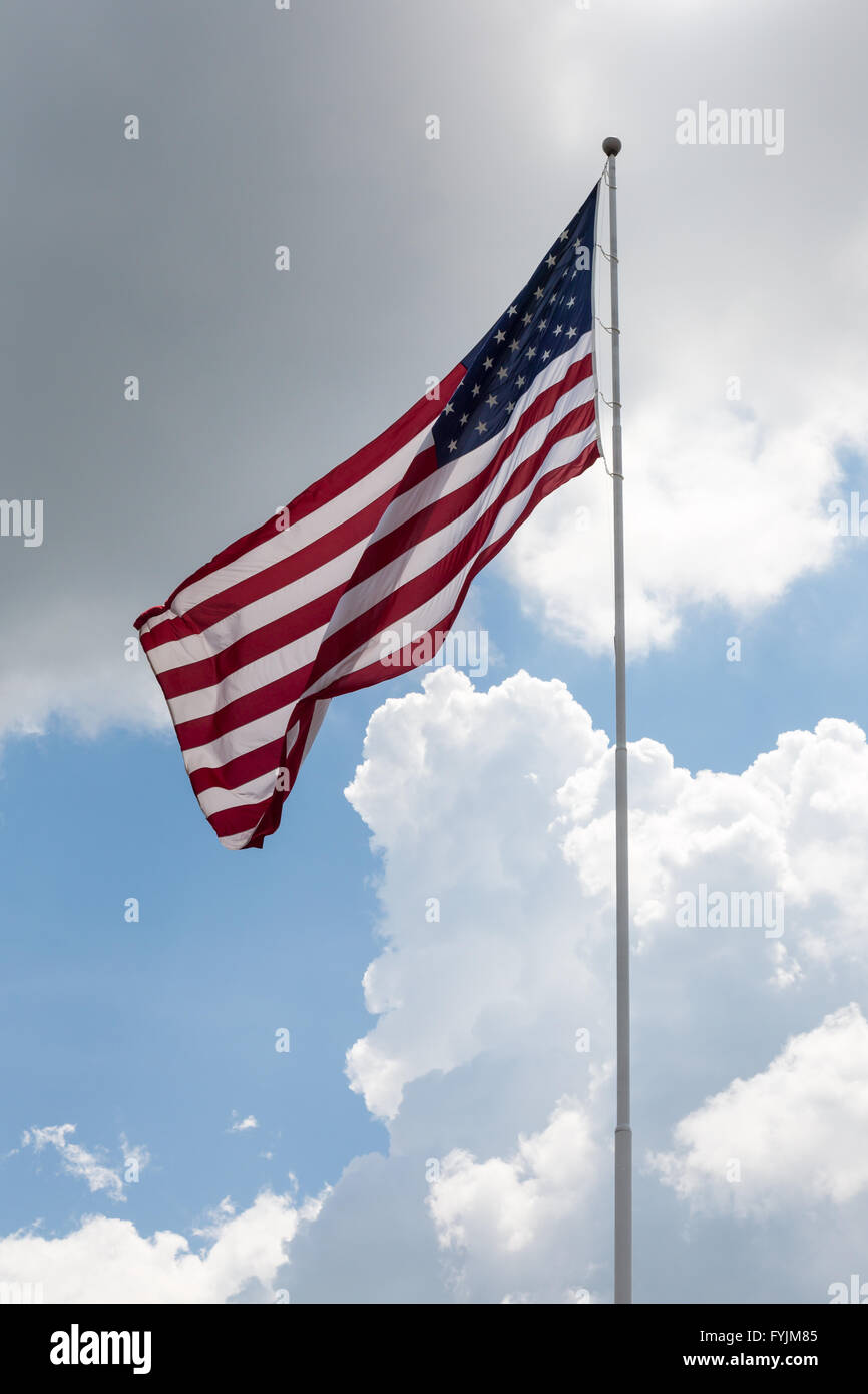 American Flag flying on a flag pole Stock Photo - Alamy