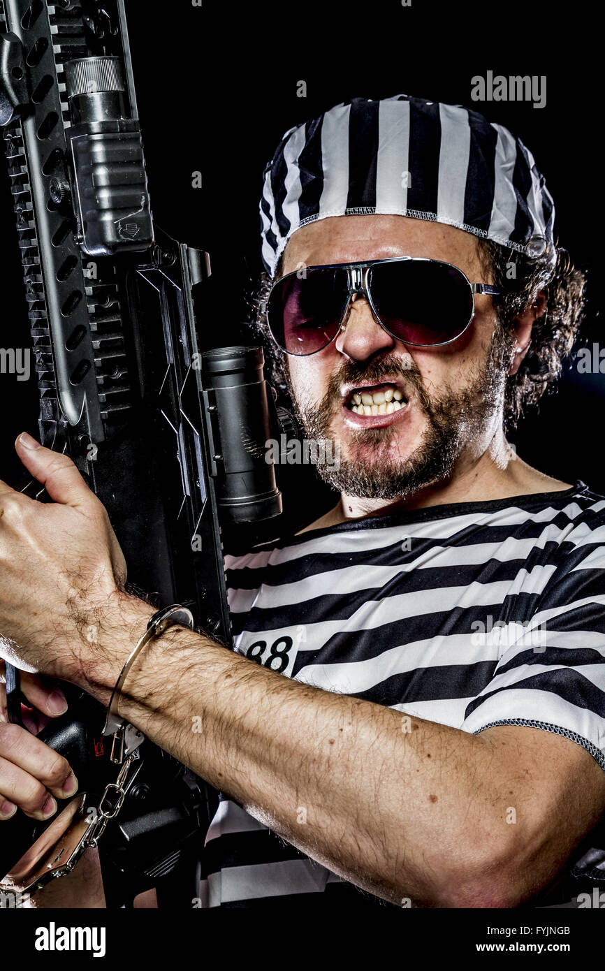 Power, Prison riot concept. Man holding a machine gun, prisoner Stock ...