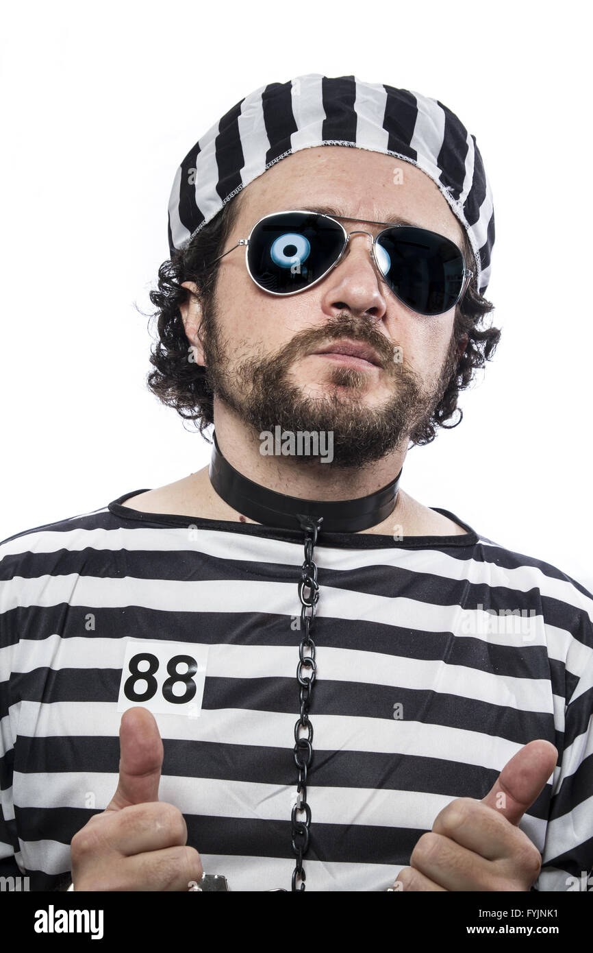 Prison, one caucasian man prisoner criminal with chain ball and ...
