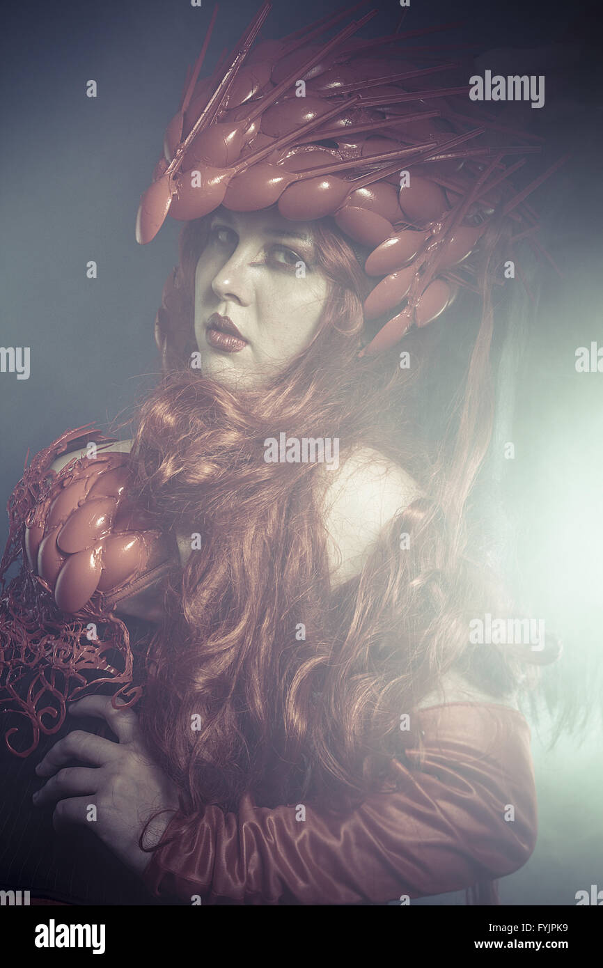 Beast, beautiful woman dressed in red armor dragon scales Stock Photo ...