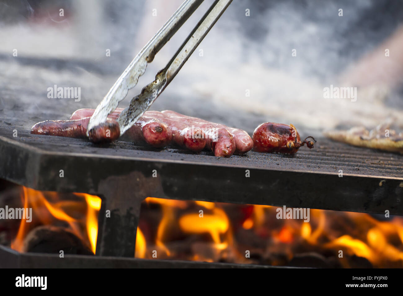 barbecue with sausages and lamb in a medieval fair, Spain Stock Photo ...