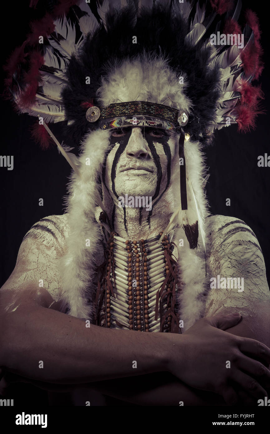 American Indian chief with big feather headdress, warrior Stock Photo ...