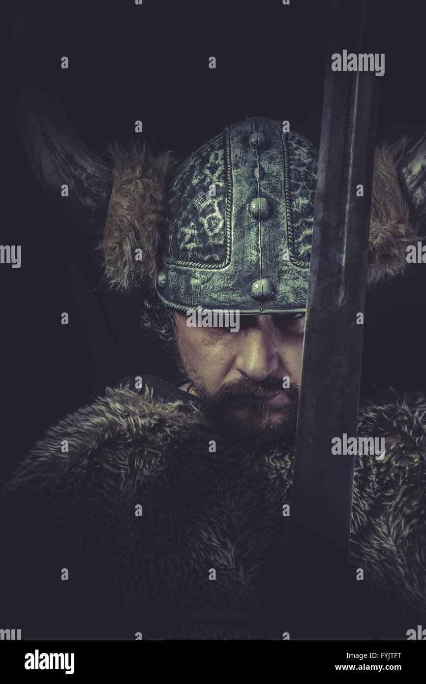 Costume, Viking warrior with a huge sword and helmet with horns Stock ...