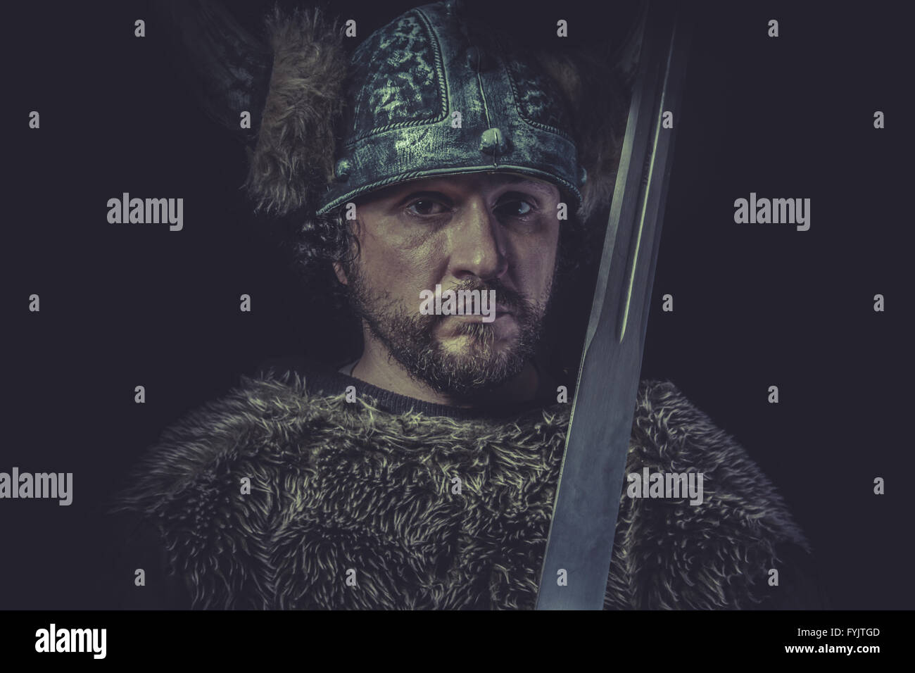 Costume, Viking warrior with a huge sword and helmet with horns Stock ...