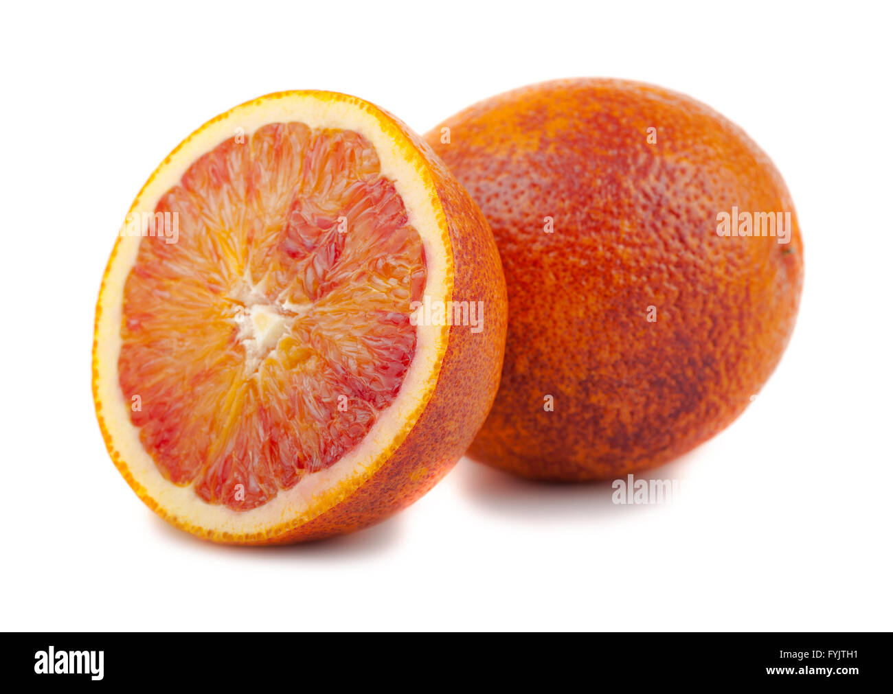 Half and full bloody red oranges Stock Photo - Alamy