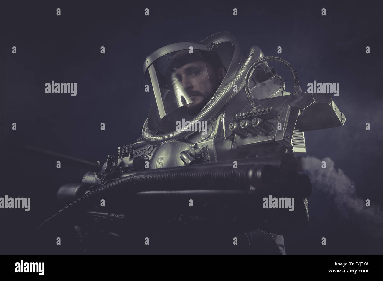 spaceman in silver armor and huge cannon Stock Photo - Alamy