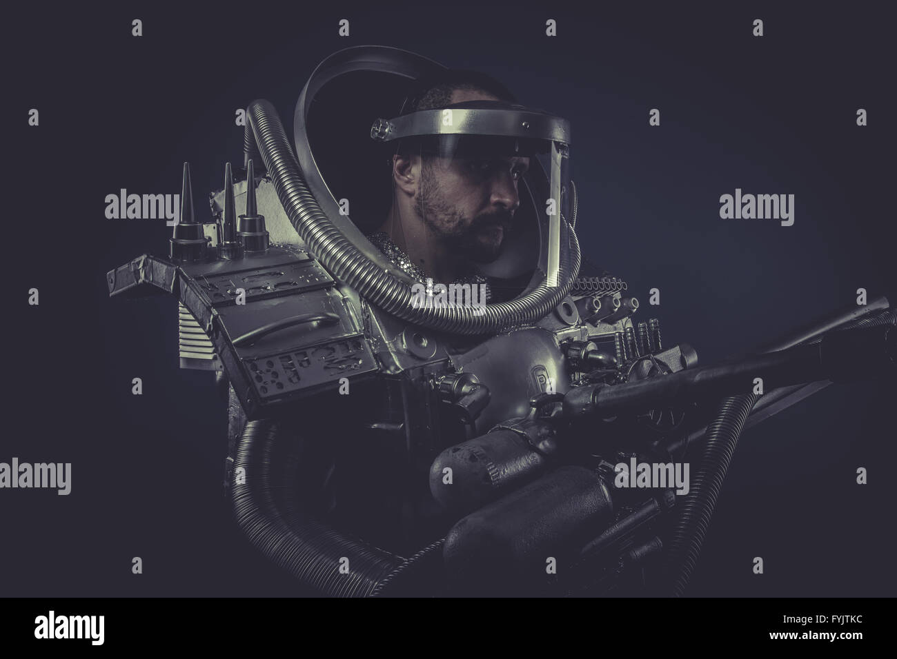 orbit, spaceman in silver armor and huge cannon Stock Photo - Alamy