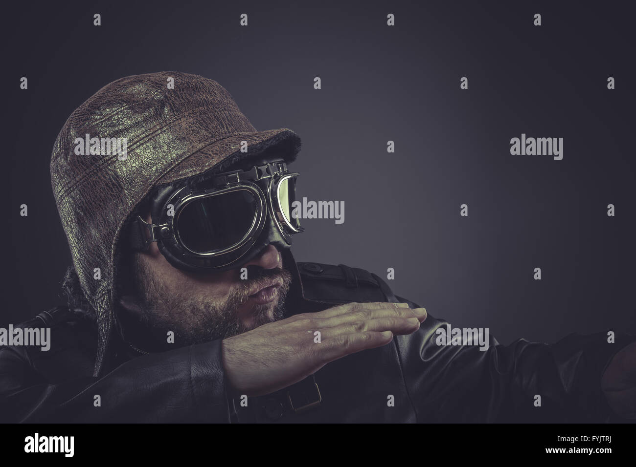 airplane, pilot dressed in vintage style leather cap and goggles Stock ...