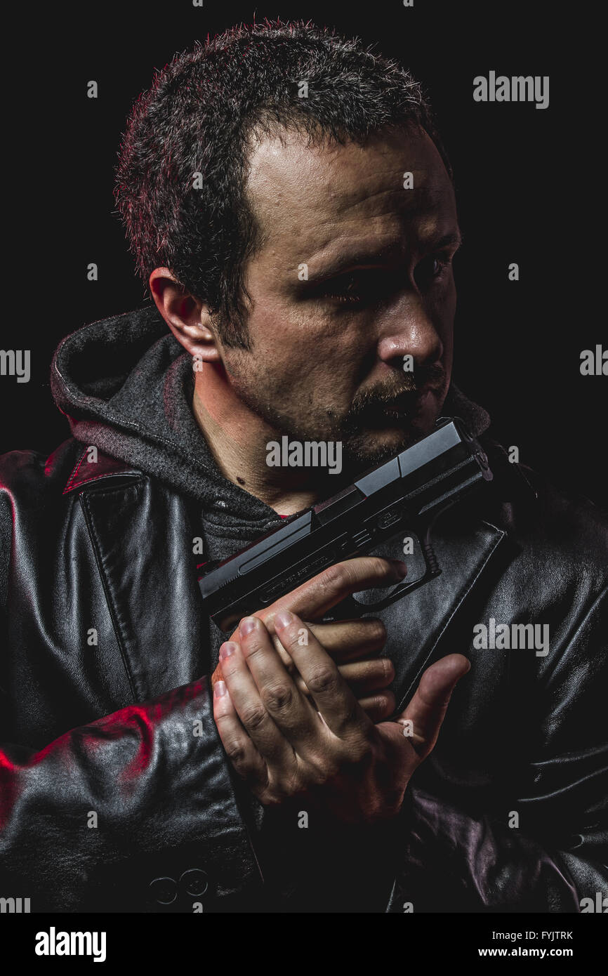 Man with gun leather jacket hi-res stock photography and images - Alamy