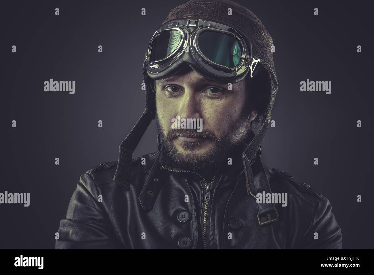 steampunk pilot dressed in vintage style leather cap and goggles Stock ...