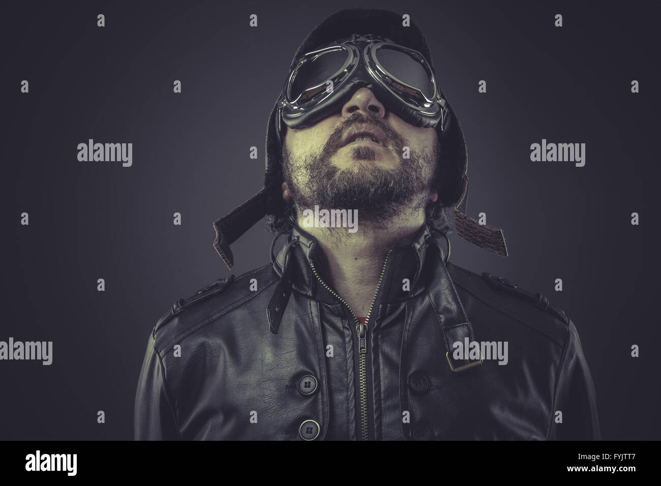 retro pilot dressed in vintage style leather cap and goggles Stock ...