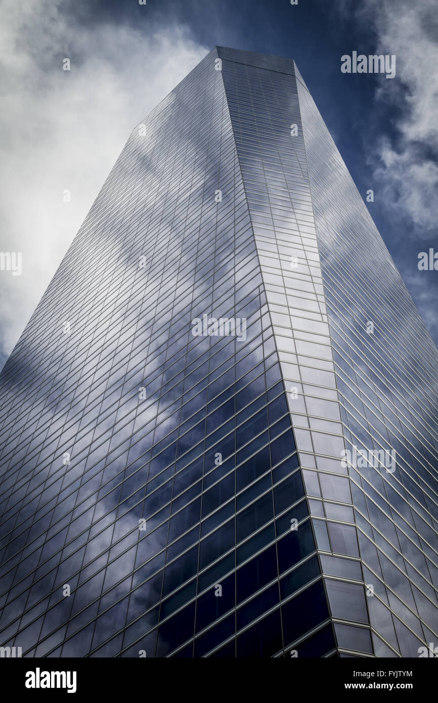 enterprise, skyscraper with glass facade and clouds reflected in ...