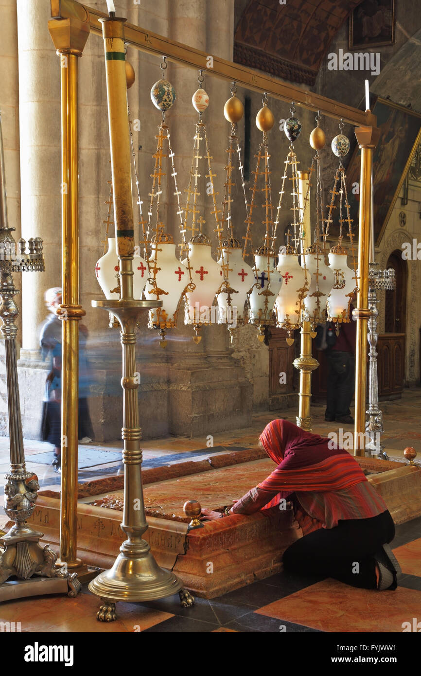 The pilgrim in red clothes passionately prays Stock Photo - Alamy